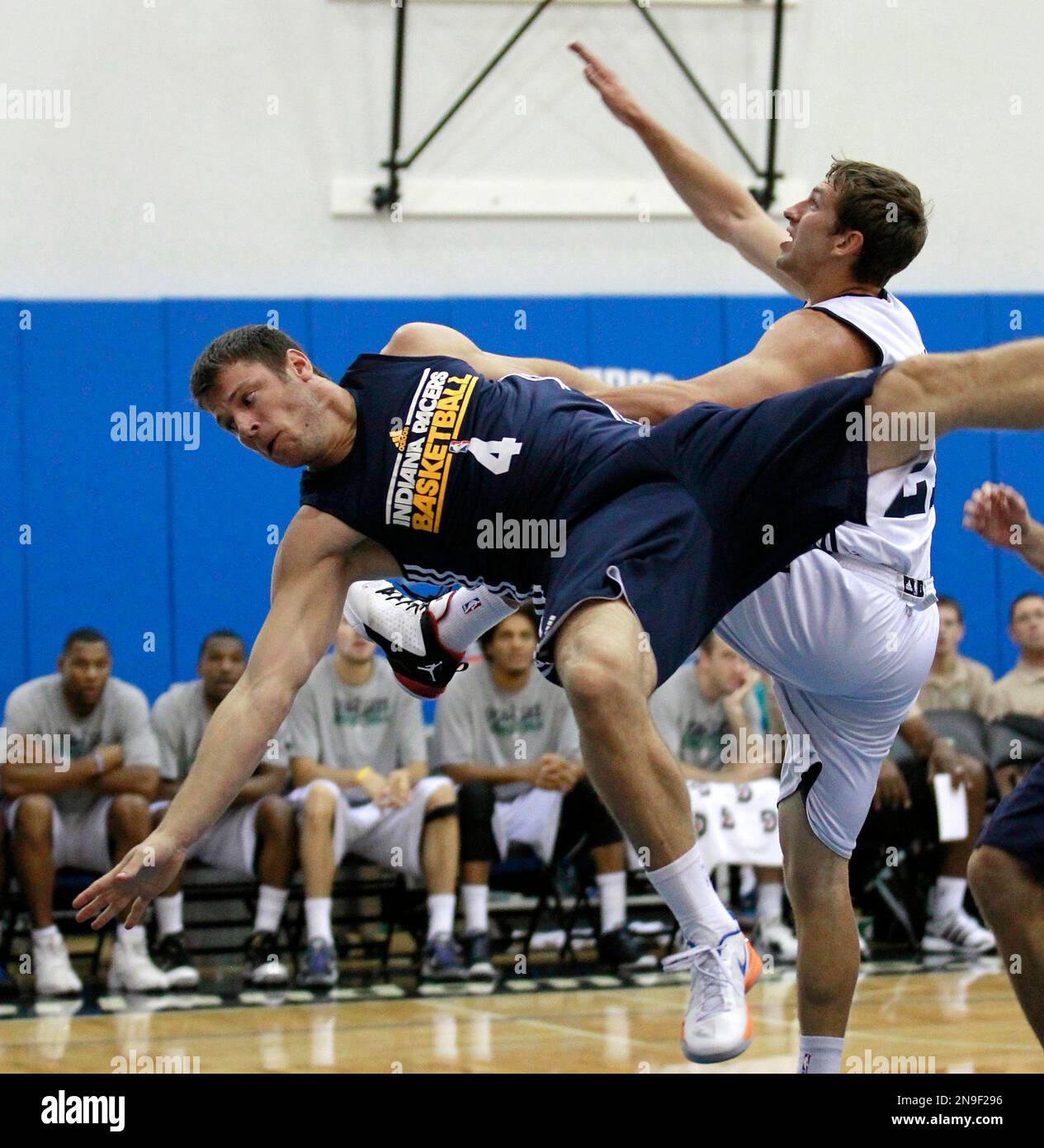 Indiana Pacers' Chris Kramer (4) falls hard to the floor after he was ...