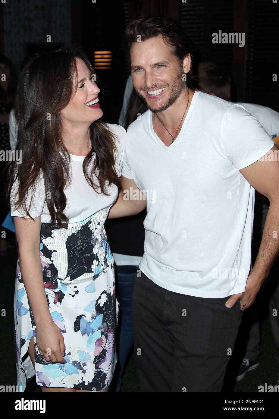 Actress Elizabeth Reaser, left, and actor Peter Facinelli pose together ...