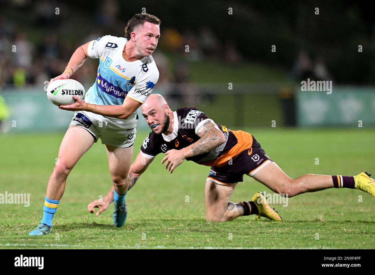 Thomas Weaver (left) of the Titans gets past Jack Ahearn (right) of the ...