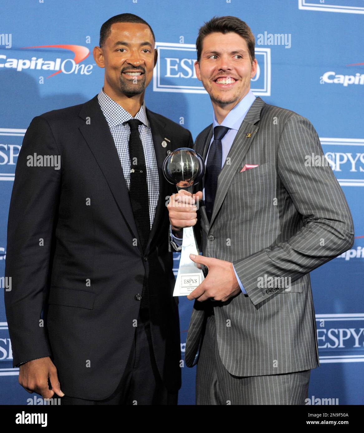 Miami Heat's Juwan Howard, left, and MIke Miller, pose with the award ...