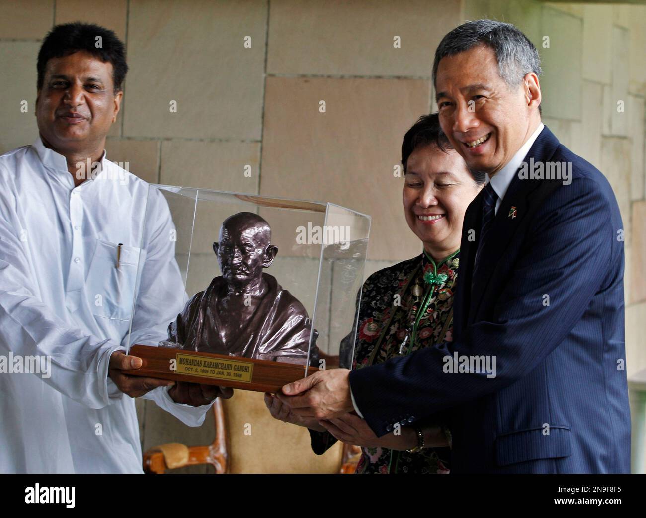 Singapore's Prime Minister Lee Hsien Loong, right, and his wife Ho ...
