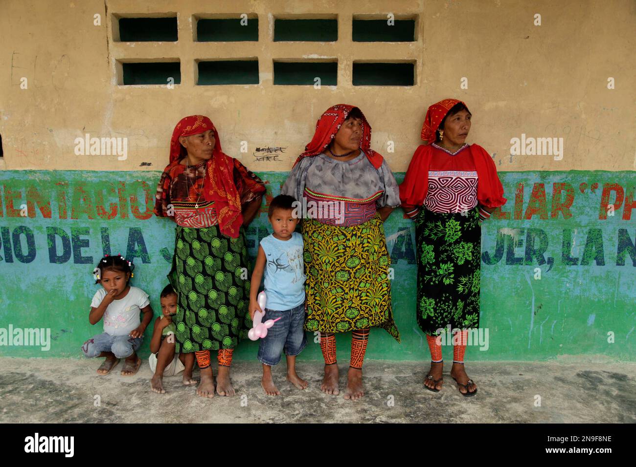 Kuna Indigenous people attend a school event outside a school in Niadup ...