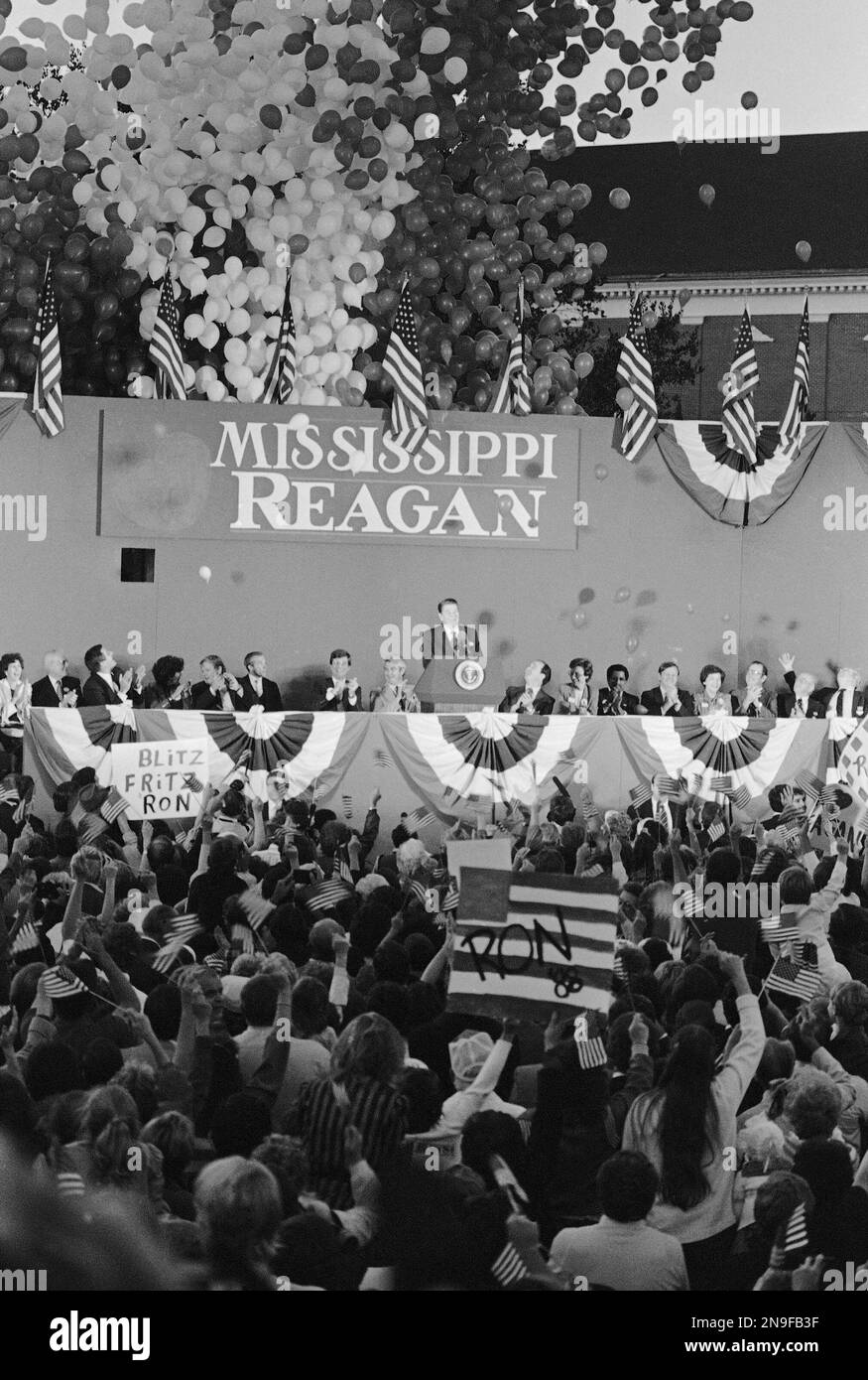 President Ronald Reagan is surrounded by fans and balloons while ...