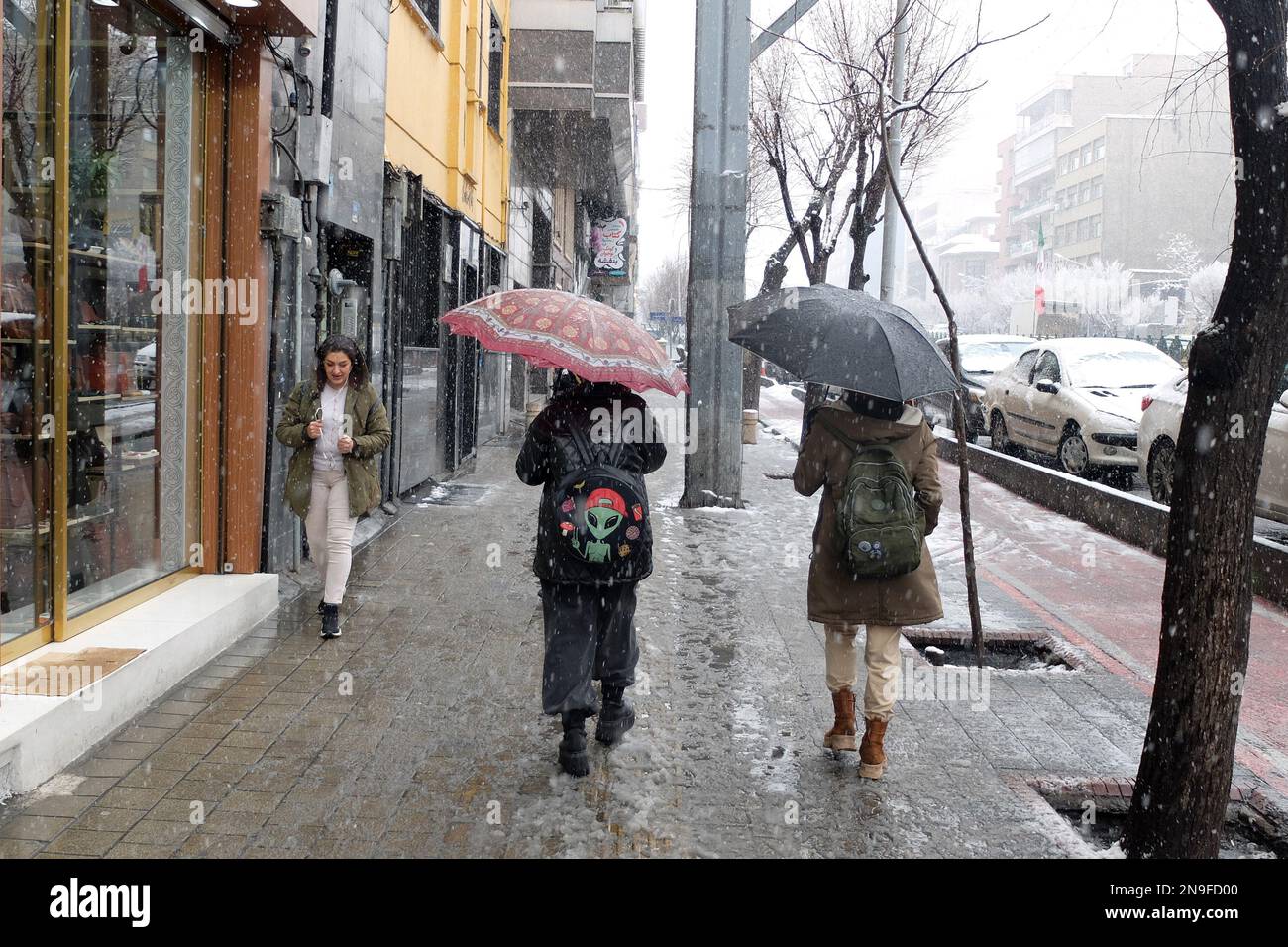 Tehran, Tehran, Iran. 12th Feb, 2023. Two Iranian women using umbrellas ...