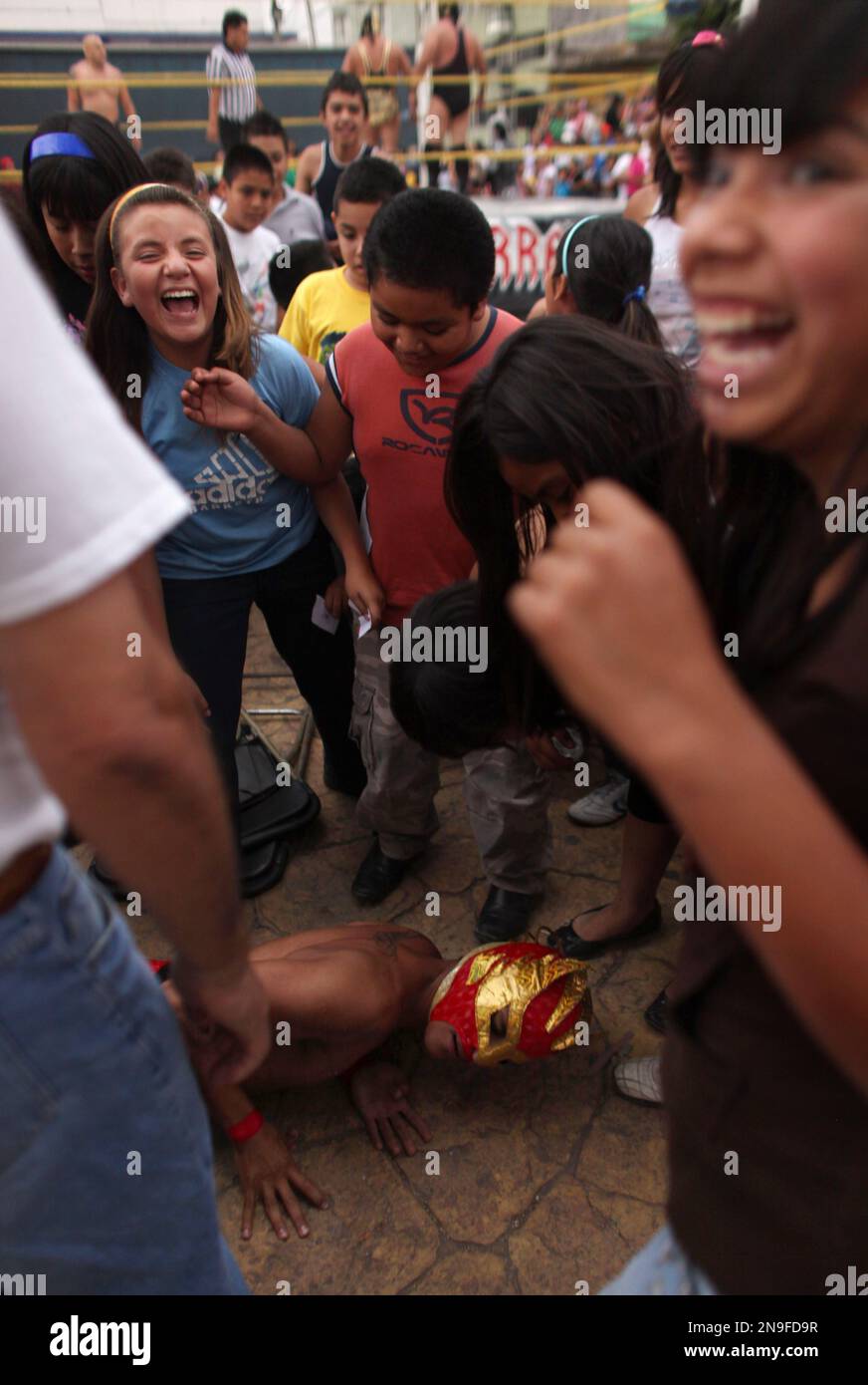 In this photo taken April 30, 2012, a Mexican Lucha Libre wrestler lies ...