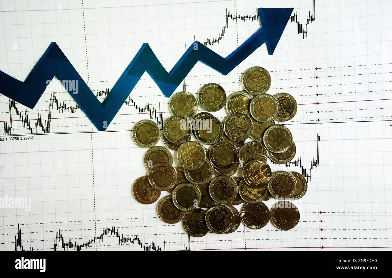 Business diagram on financial report with coins Stock Photo - Alamy