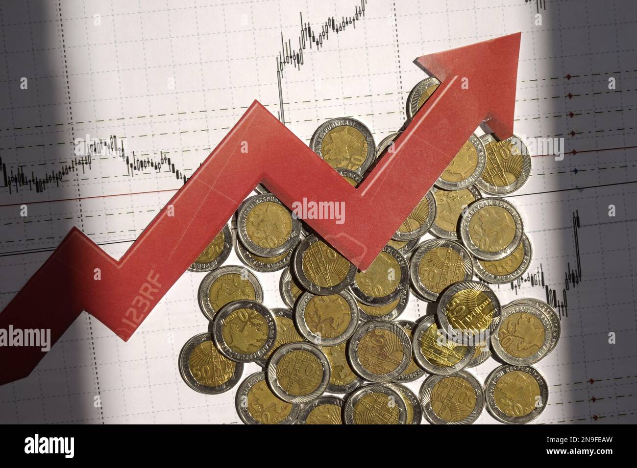 Business diagram on financial report with coins Stock Photo - Alamy