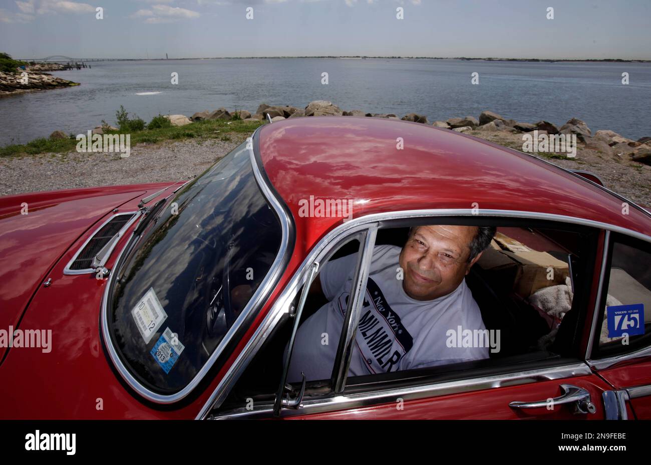 Irv Gordon poses for a picture in his Volvo P1800 in Babylon, N.Y ...