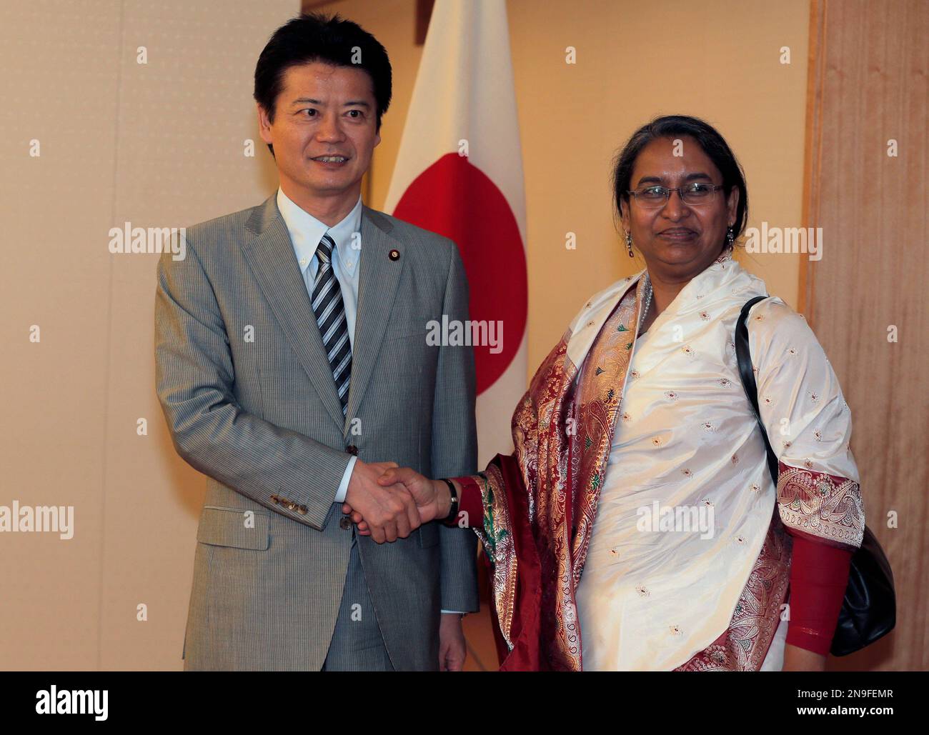 Bangladeshi Foreign Minister Dipu Moni, right, is greeted by his ...