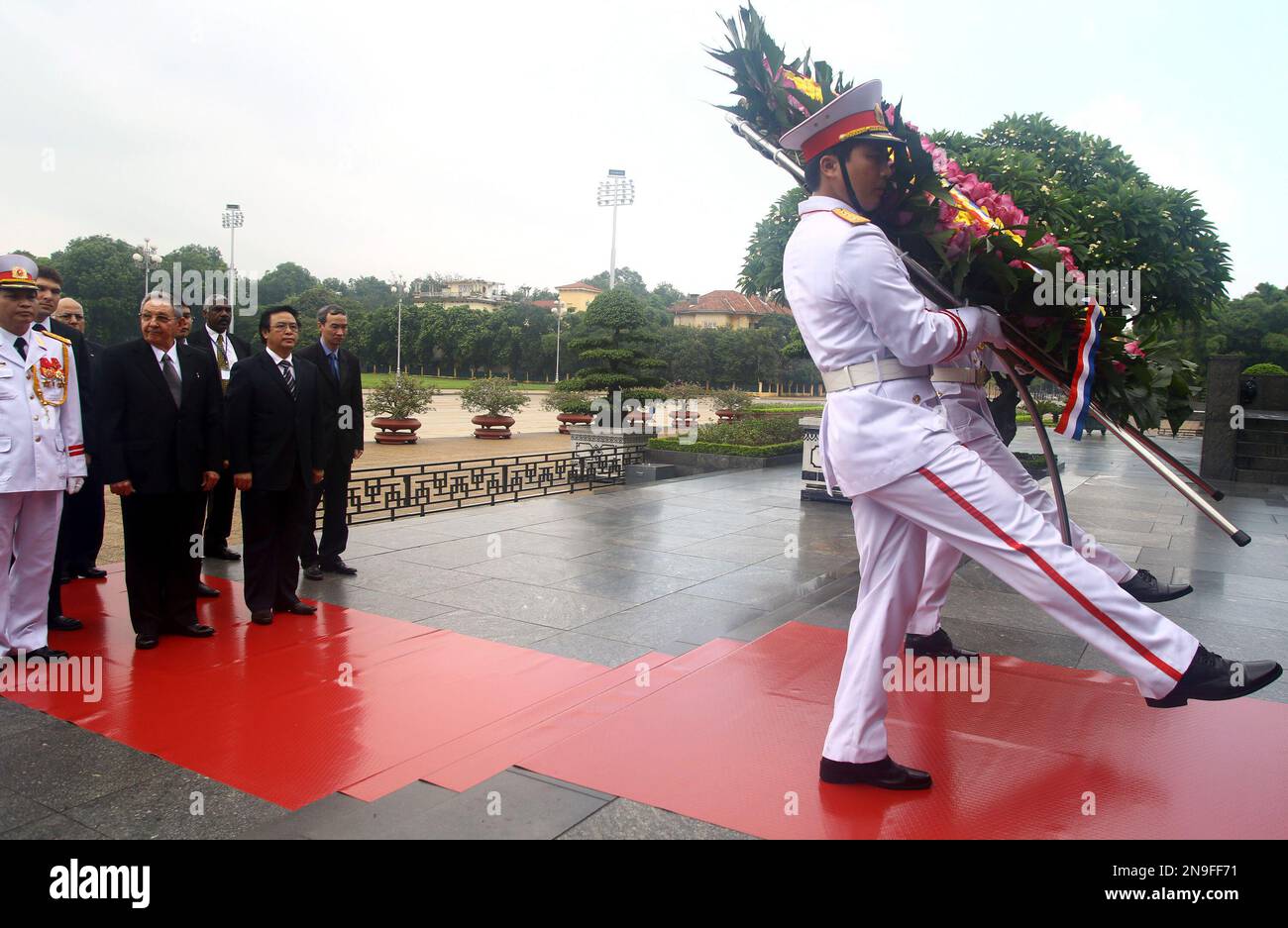 Cuban President Raul Castro, second from left, stands at the mausoleum ...