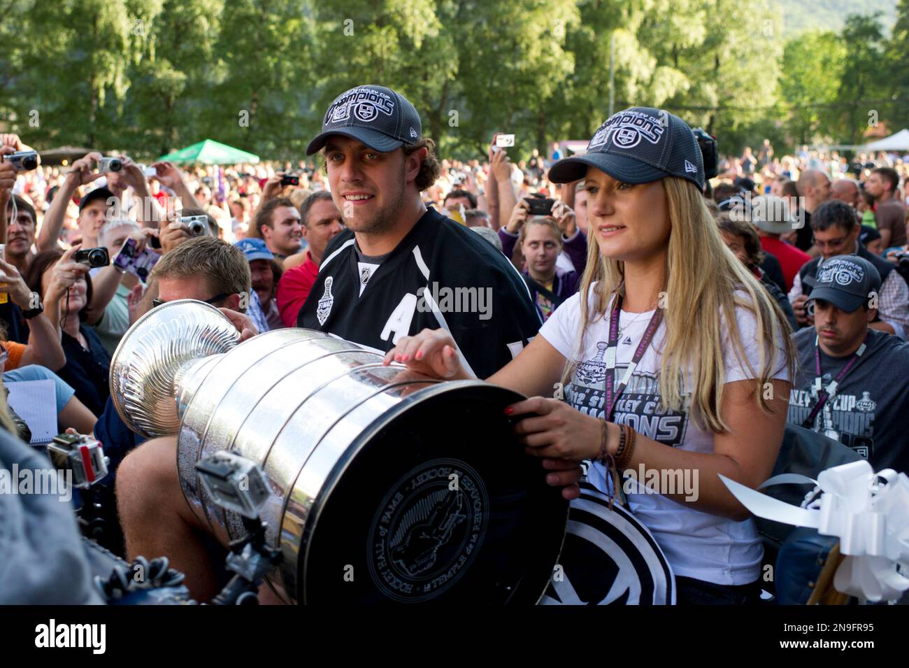 Slovenian ice hockey player Anze Kopitar, center, with his girlfriend ...