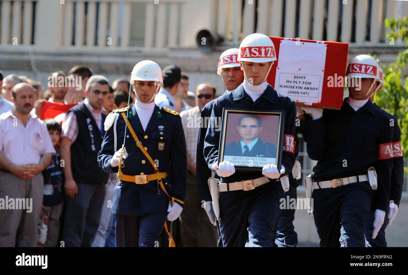 Turkish soldiers carry the coffin of one of two pilots, Lieutenant ...