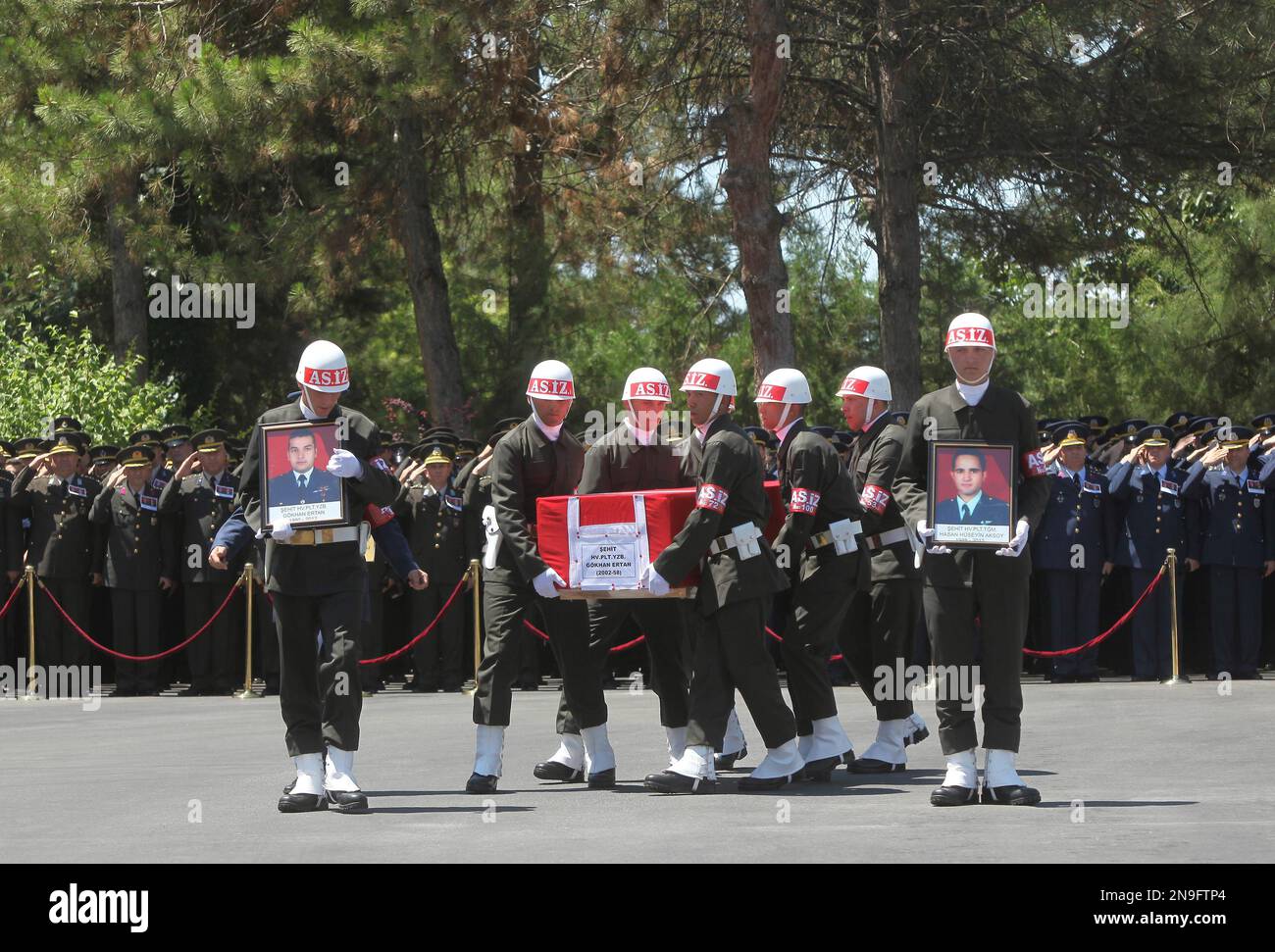 Turkish soldiers carry the coffin of one of two Turkish pilots, Captain ...