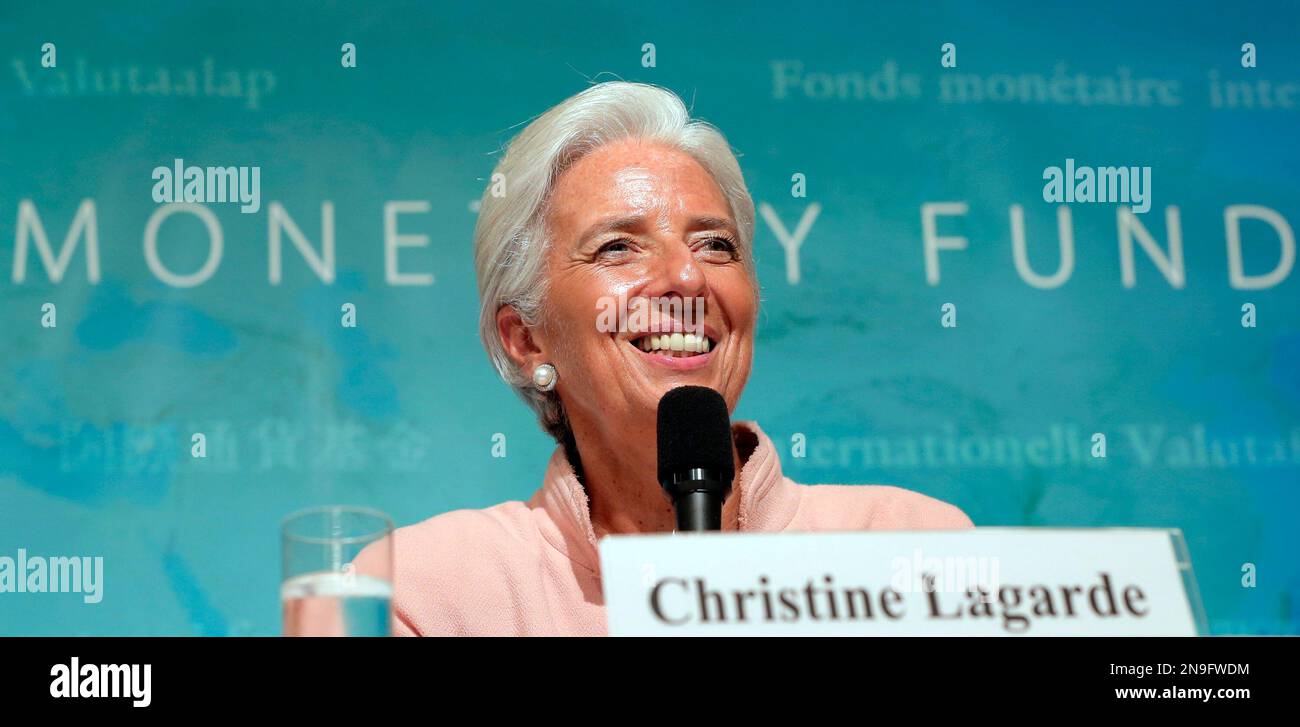 IMF Managing Director Christine Lagarde smiles during a news conference ...