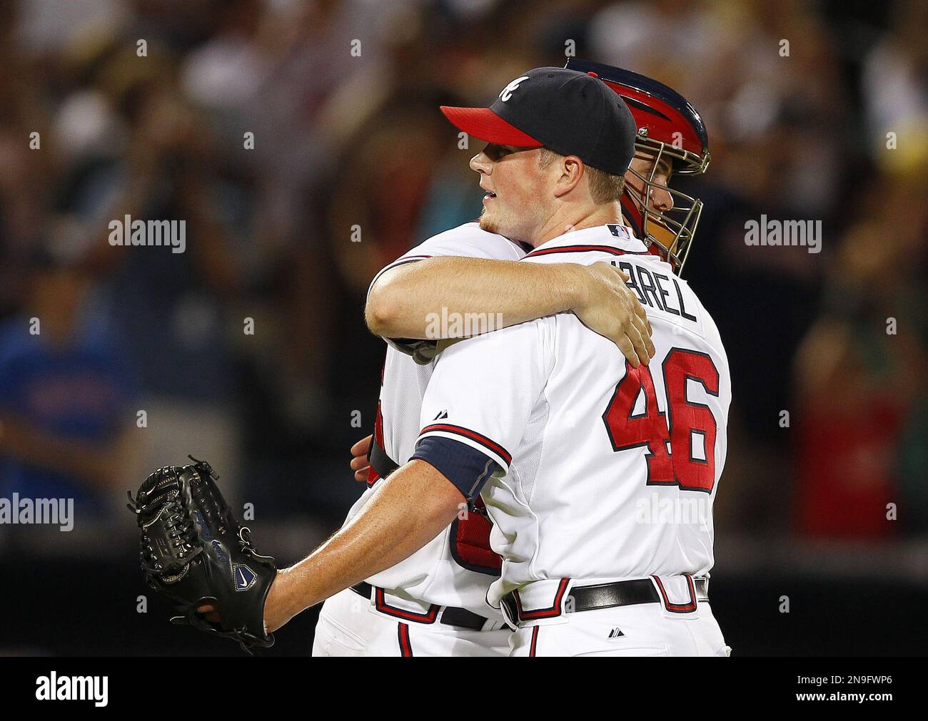 Atlanta Braves relief pitcher Craig Kimbrel (46) embraces catcher Brian ...