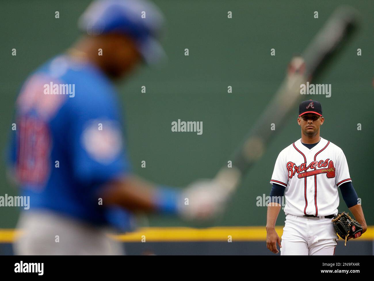 Atlanta Braves starting pitcher Randall Delgado, right, throws to ...