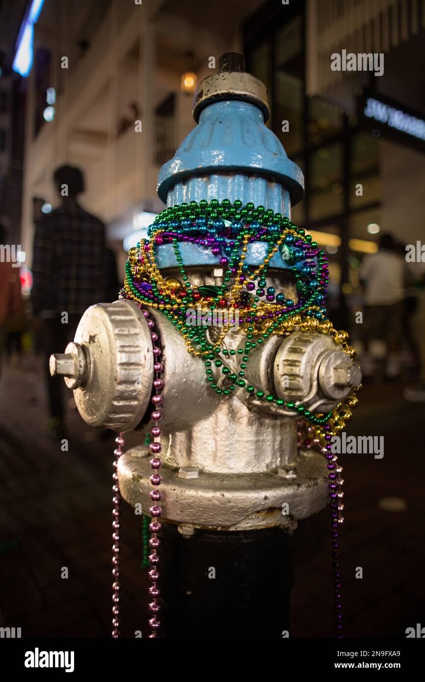 Aftermath of Mardi Gras parade - fire hydrant littered/bedecked with ...