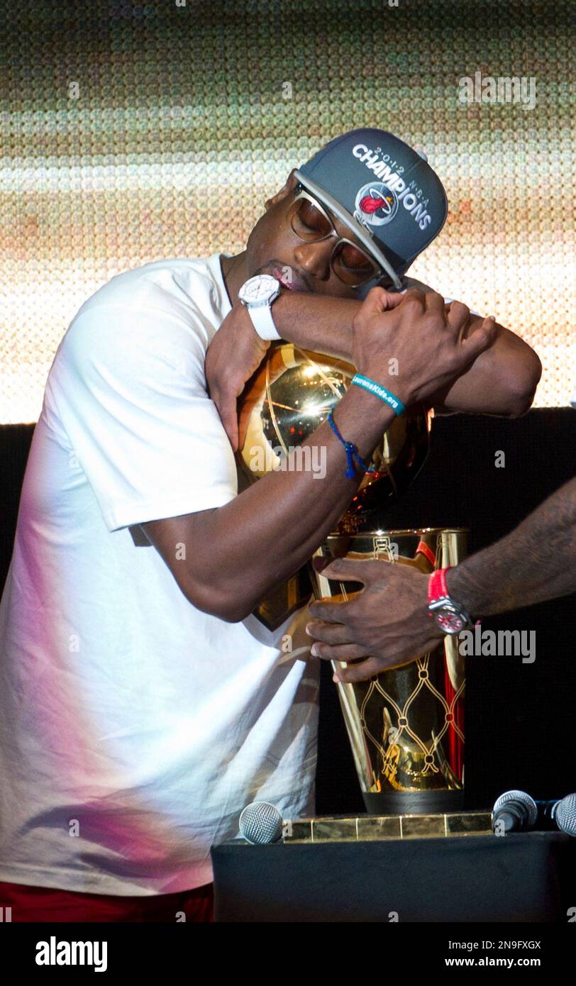 Miami Heat's Dwyane Wade hugs the NBA Championship trophy after the ...