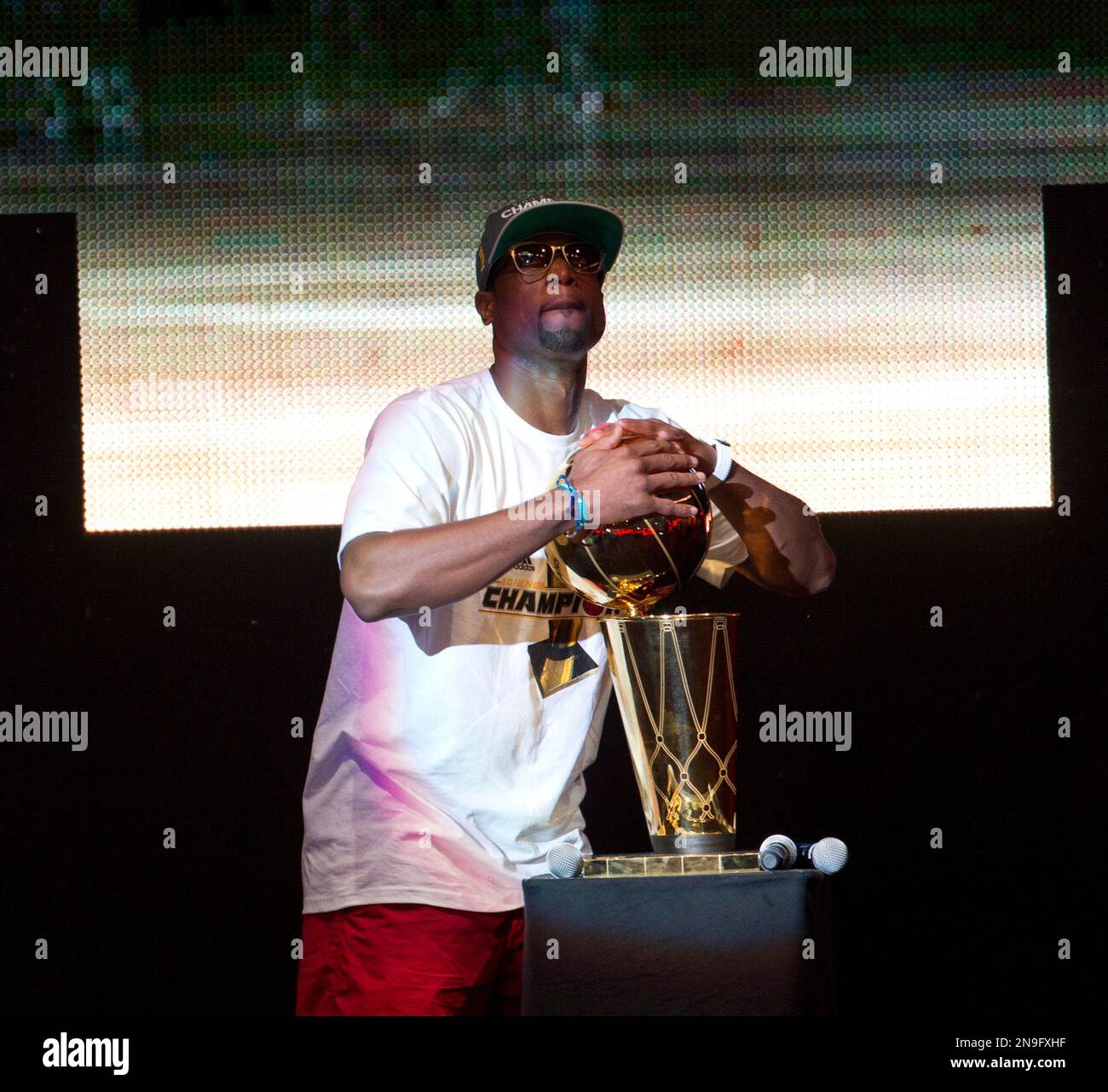Miami Heat's Dwyane Wade plays with the NBA Championship trophy after ...