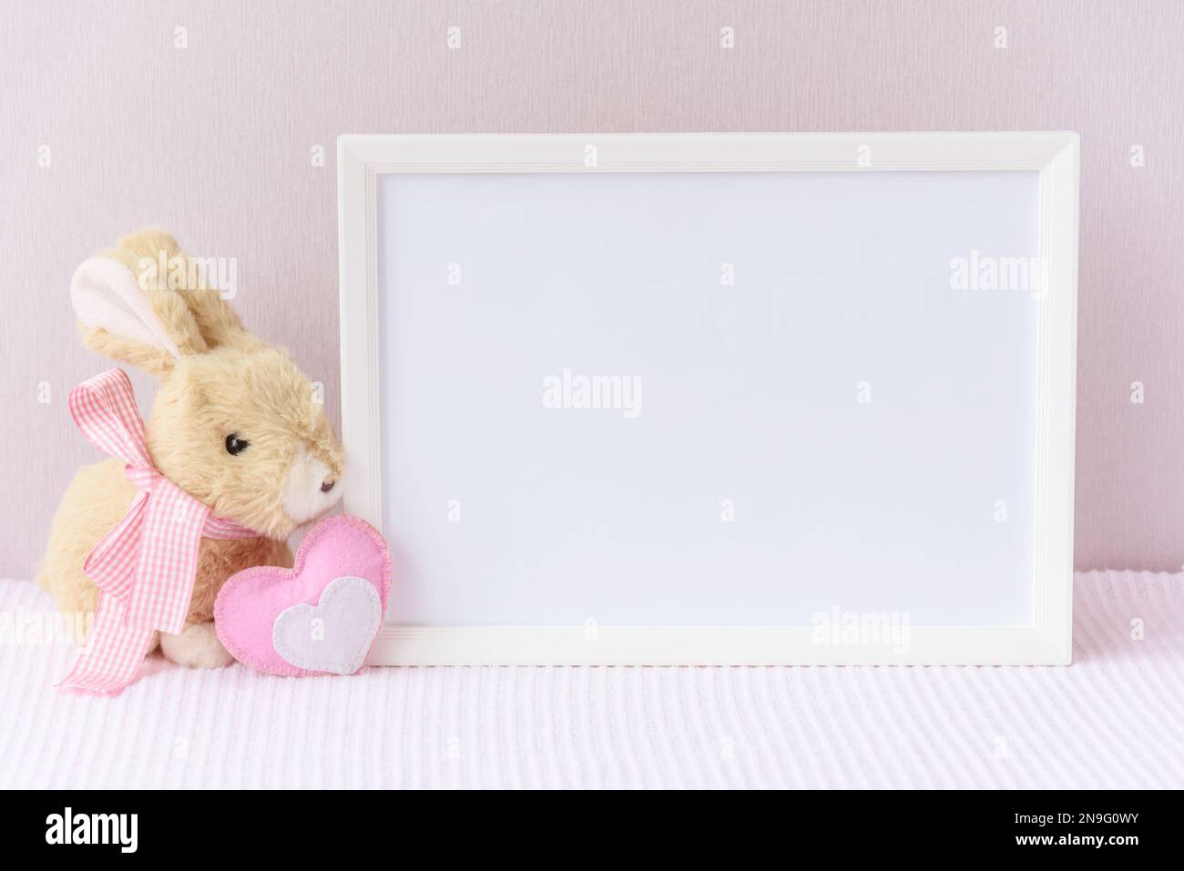 Easter mockup horizontal white frame with bunny Stock Photo - Alamy