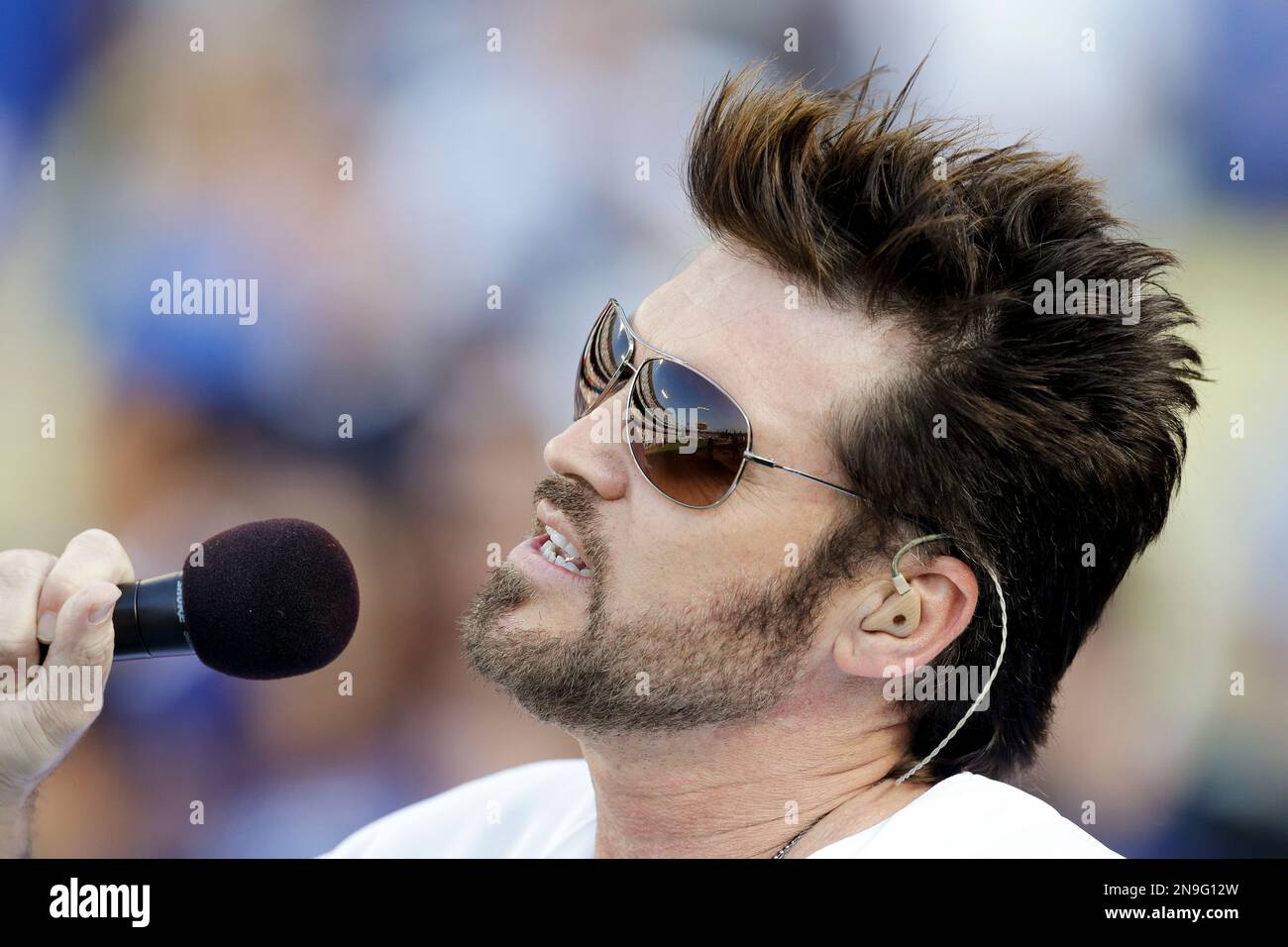 Singer Billy Ray Cyrus performs the national anthem before a baseball ...