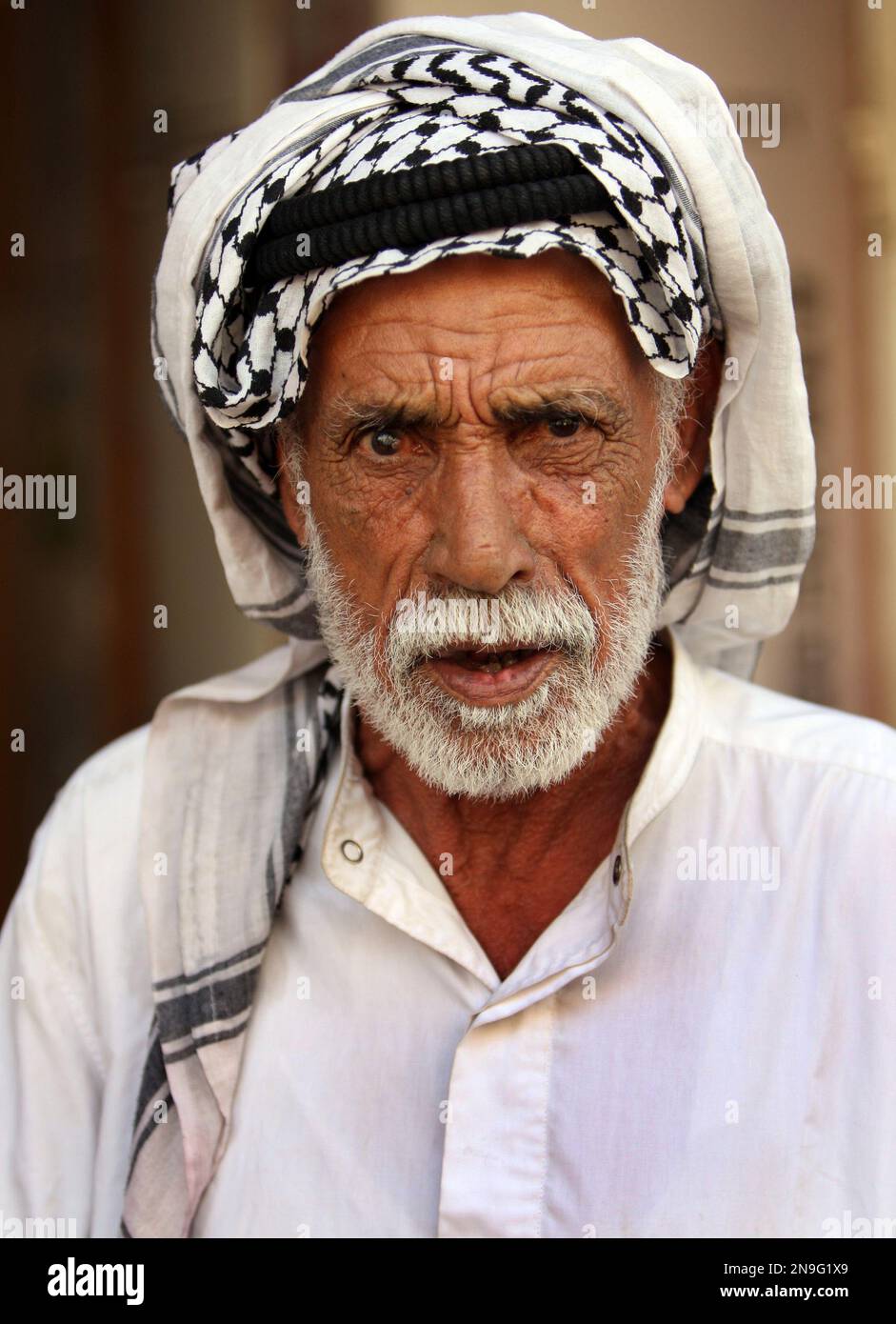 Jawad Abdul-Karim, 68, a Shiite Muslim poses for a portrait in Basra ...