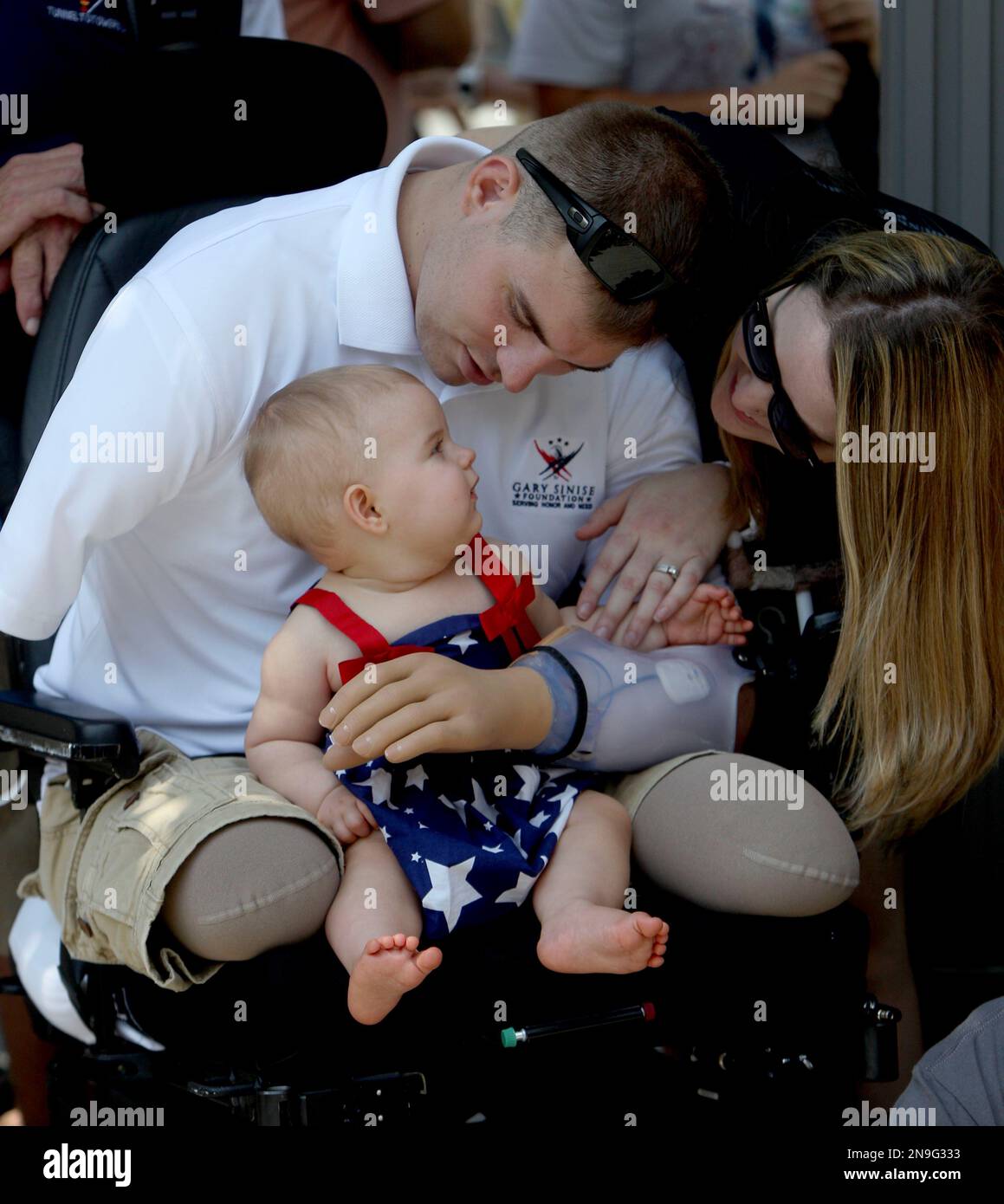 SSG Travis Mills, top, and his wife Kelsey Mills of Fort Bragg, North ...
