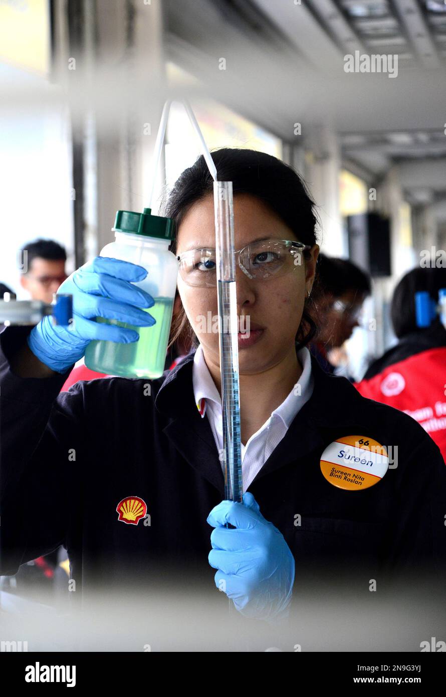 A technician measures fuel on day one of the Shell Eco-marathon ...