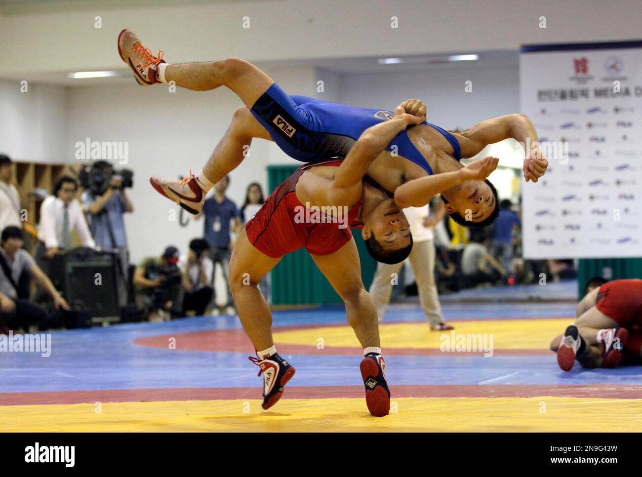 South Korean wrestler Jung Ji-hyun, bottom, trains in preparation for ...