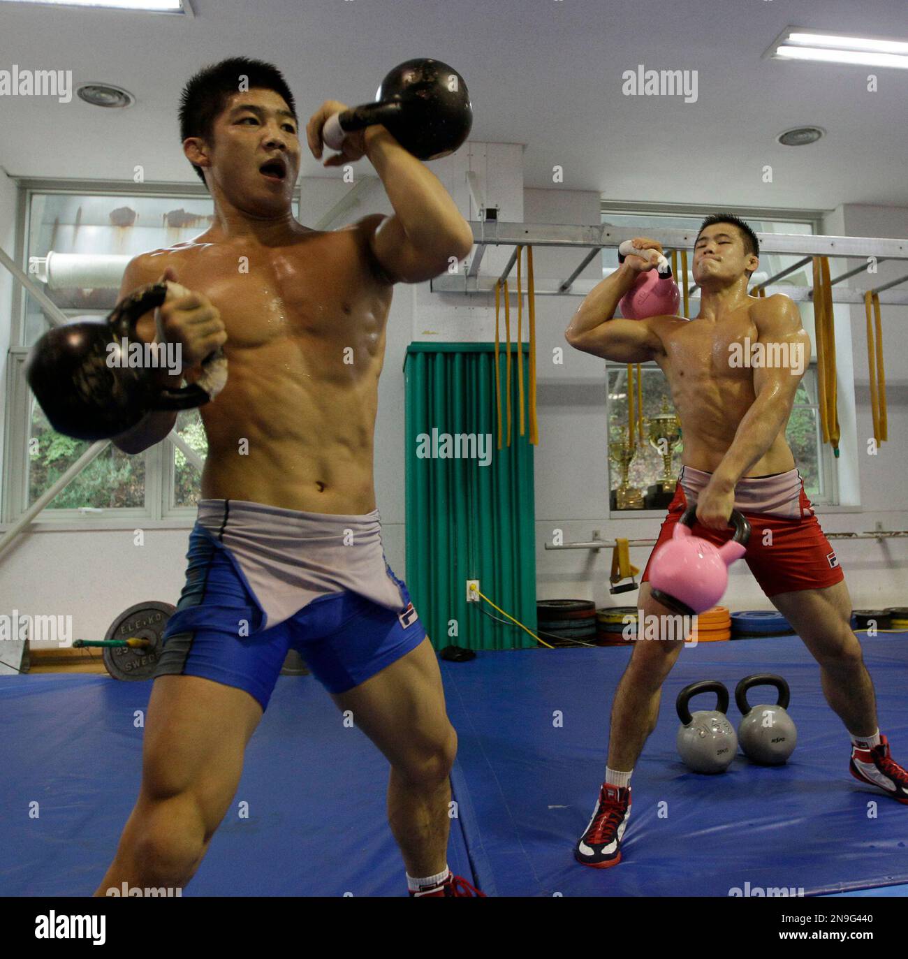 South Korean wrestler Kim Hyun-woo, left, trains in preparation for the ...