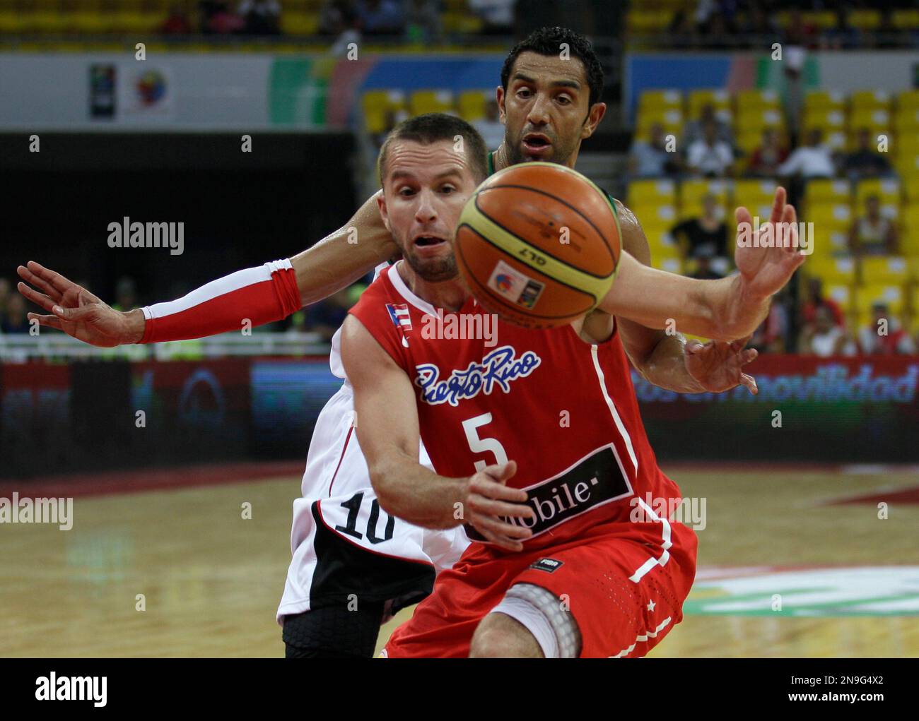 Puerto Rico's Jose Barea, front, who play for Minnesota's Timberwolves ...