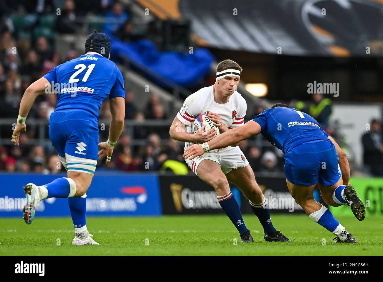 Owen Farrell of England is tackled by Danilo Fischetti of Italy during ...