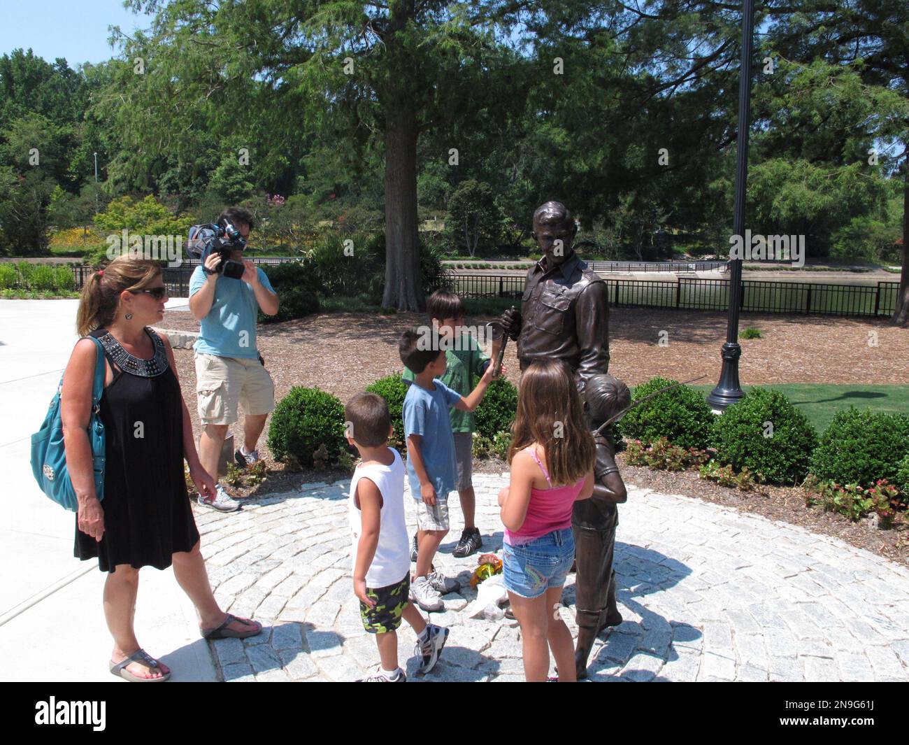 Patrice Graham and her grandchildren visit a statue of Andy Griffith at ...