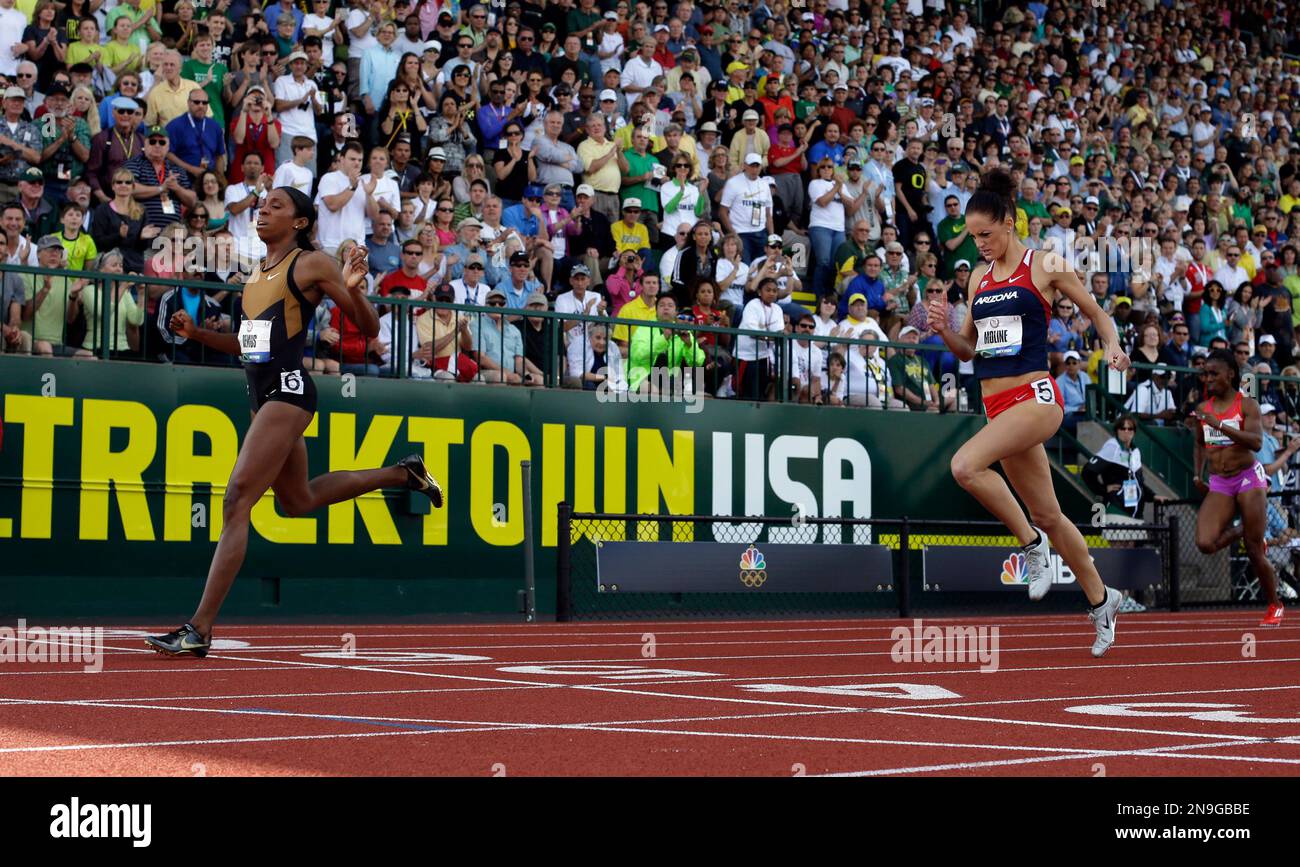 Lashinda Demus and Georganne Moline cross the finish line in the women ...