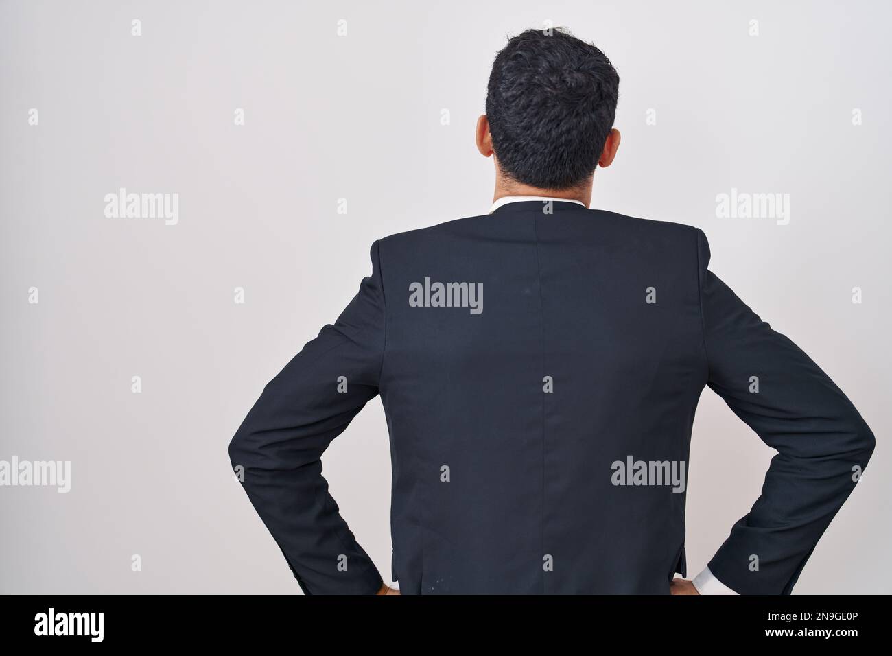 Handsome business hispanic man standing over white background standing ...