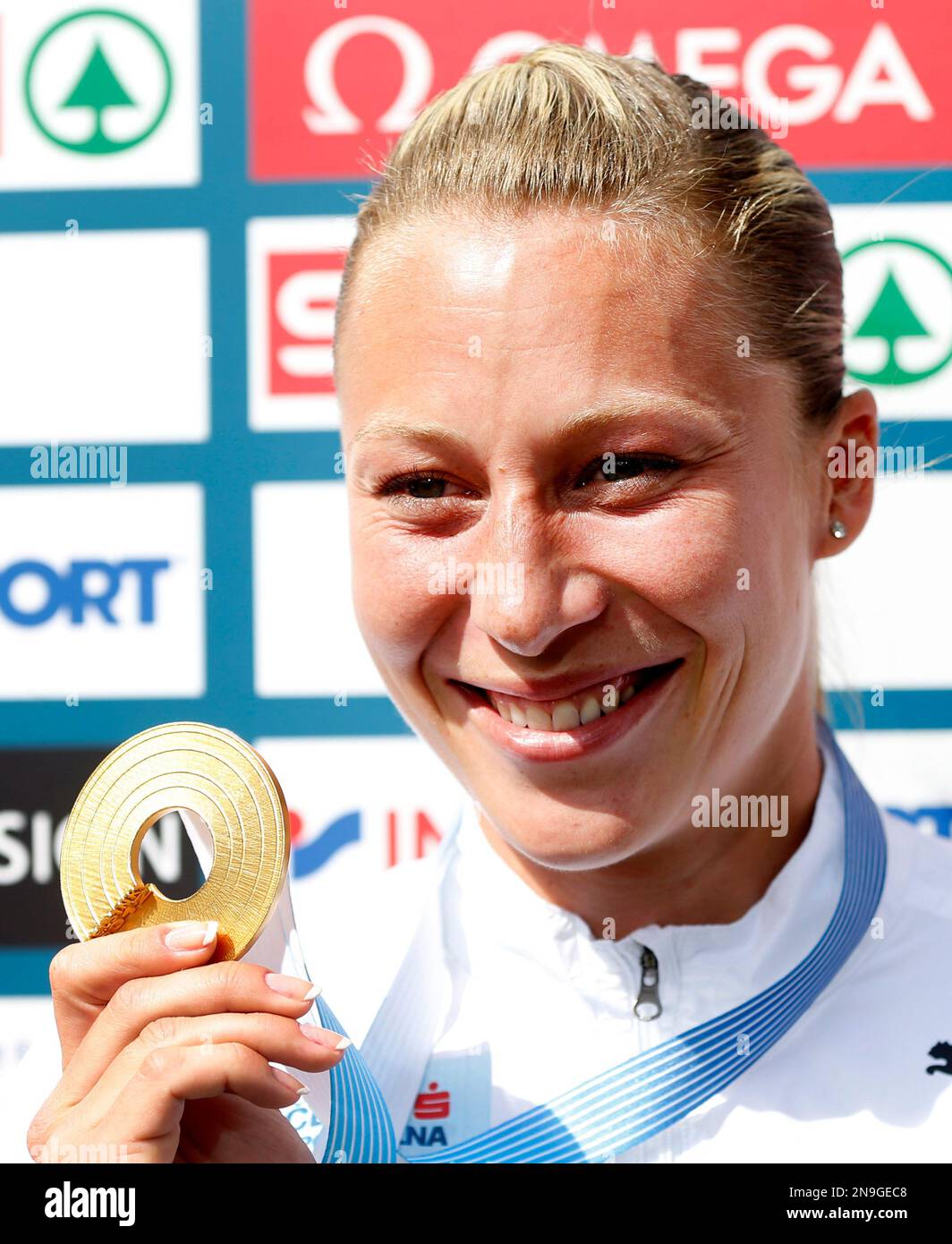 Czech Republic's Jirina Ptacnikova displays the gold medal she won in ...