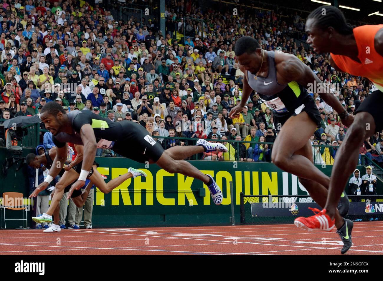Jeffery Porter, left, crosses the finish line during the men's 110 ...