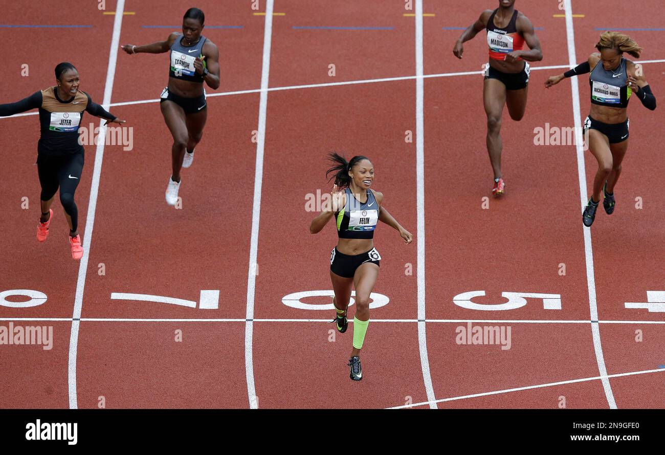 Allyson Felix, center, celebrates her first place finish in the women's ...
