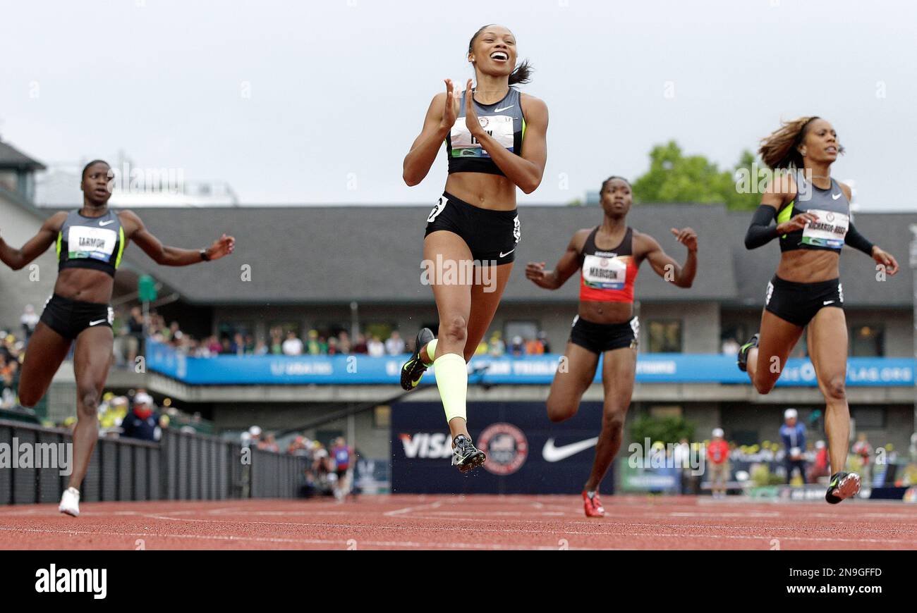 Allyson Felix, center, celebrates her first place finish in the women's ...