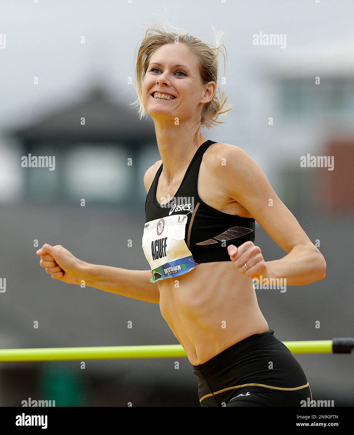 Amy Acuff reacts after making her height in the women's high jump final ...