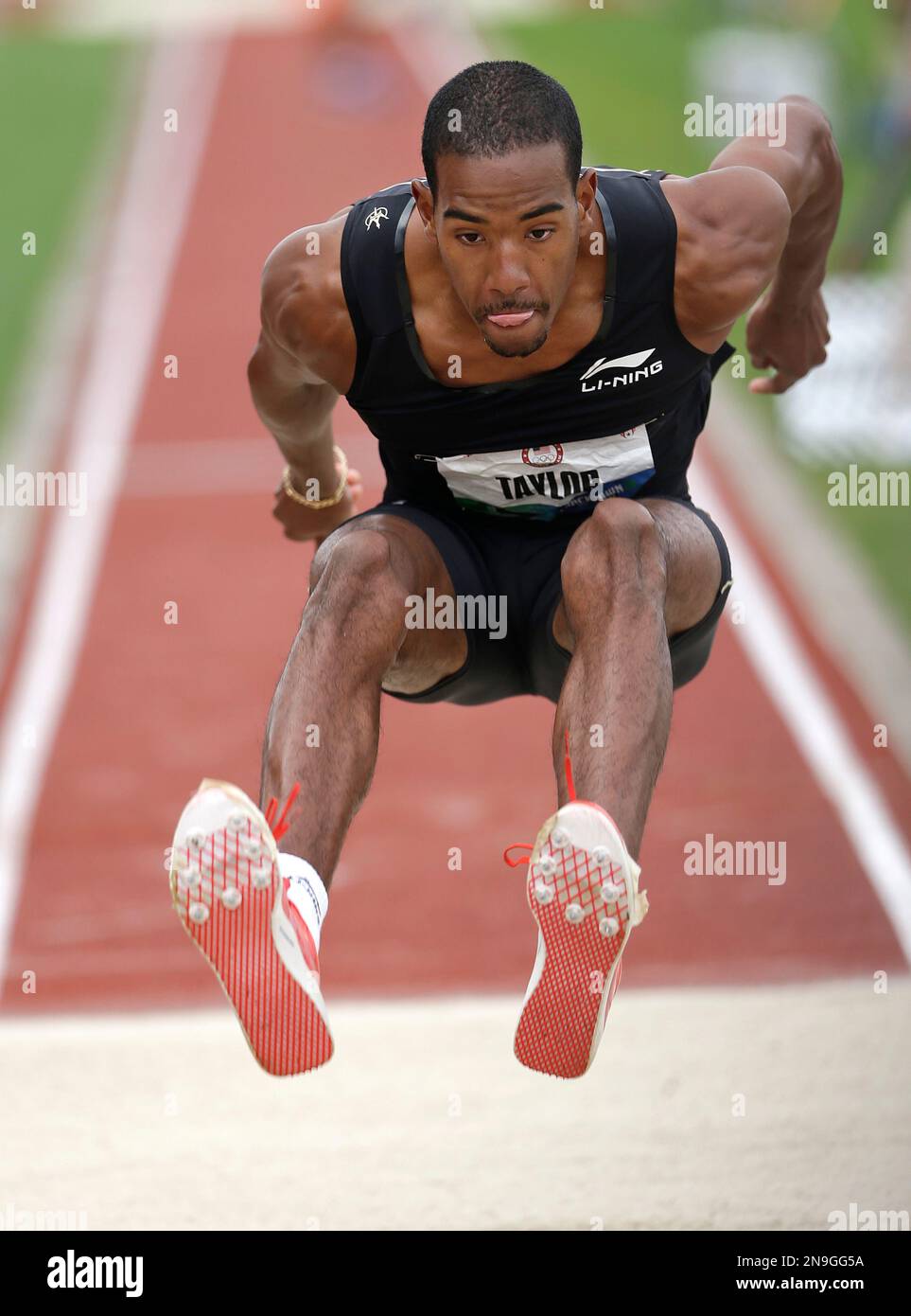 Christian Taylor competes in the men's triple jump final at the U.S ...