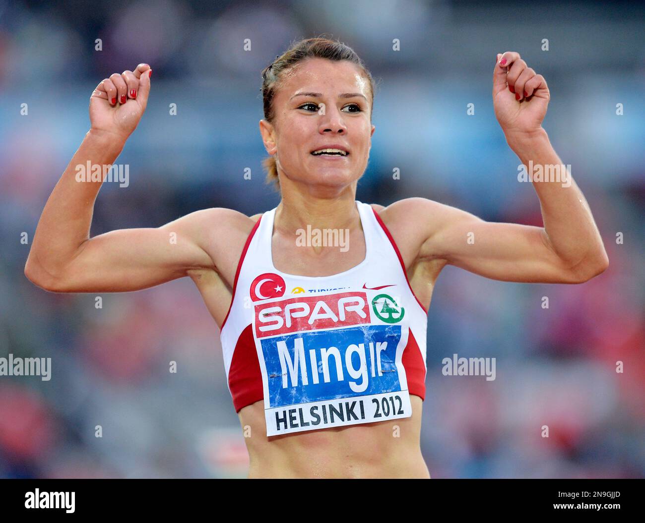 Turkey's Guelcan Mingir crosses the finish line to win the Women's 3000 ...