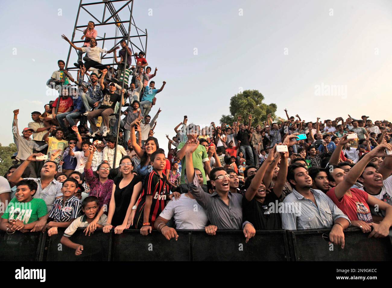 People watch and cheer Indian rap singer Honey Singh during a ...