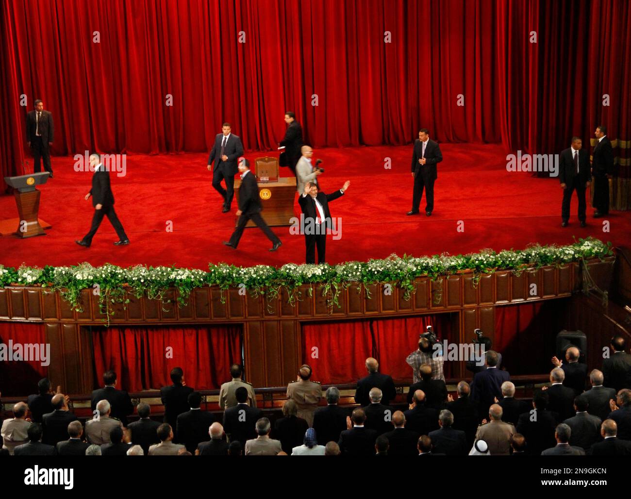 Egypt's newly inaugurated President Mohammed Morsi waves to a crowd ...