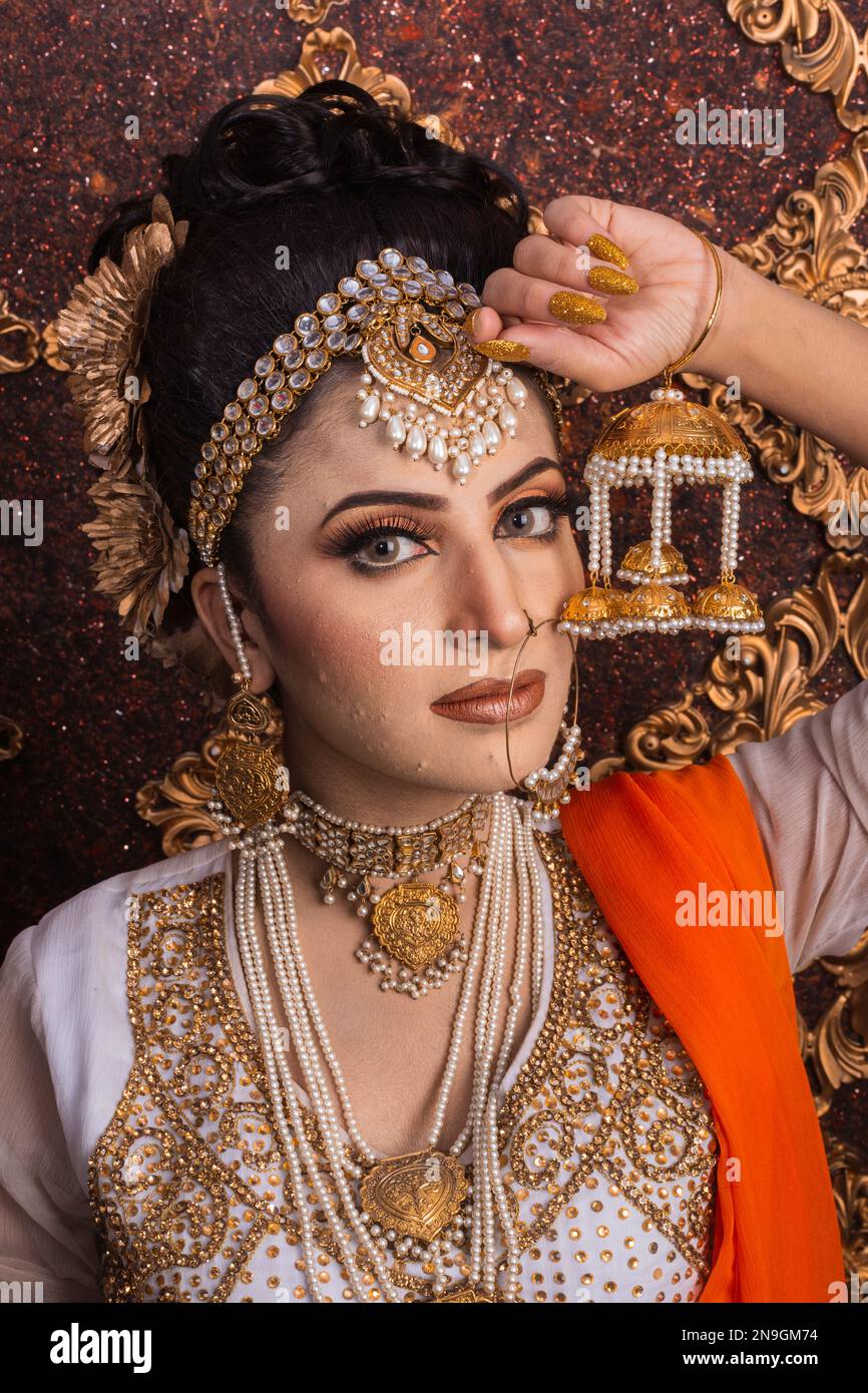 Pakistani. Indian Beautiful bride makeup for saloon shoot Stock Photo ...