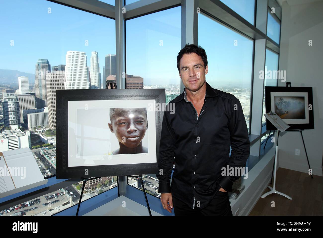 COMMERCIAL IMAGE - Mark Steines poses for a photo at his photography ...