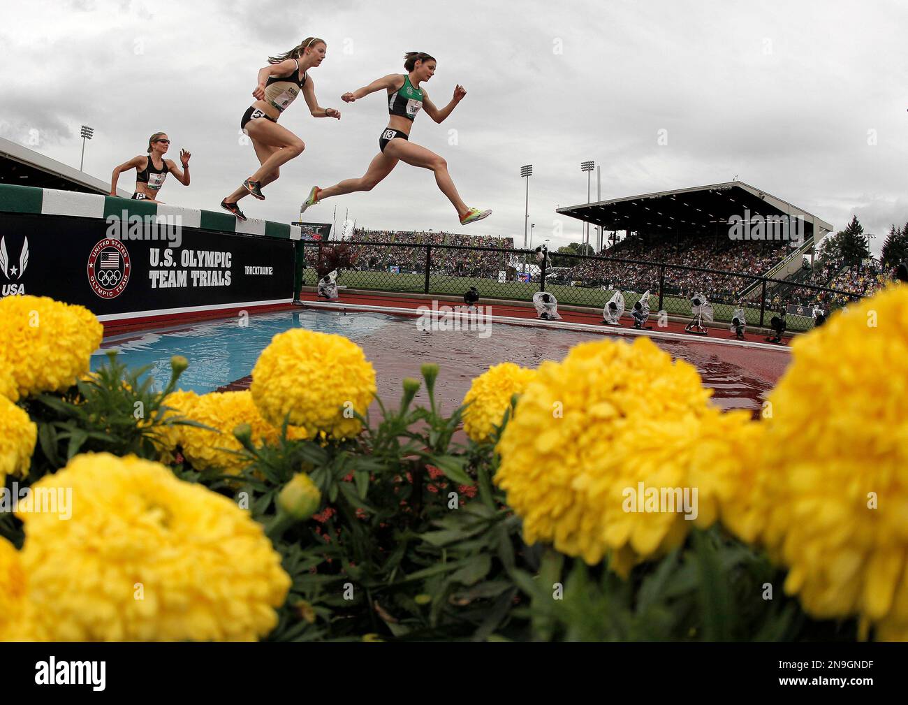 Bridget Franek, right, and Shalaya Kipp make the water jump in the ...