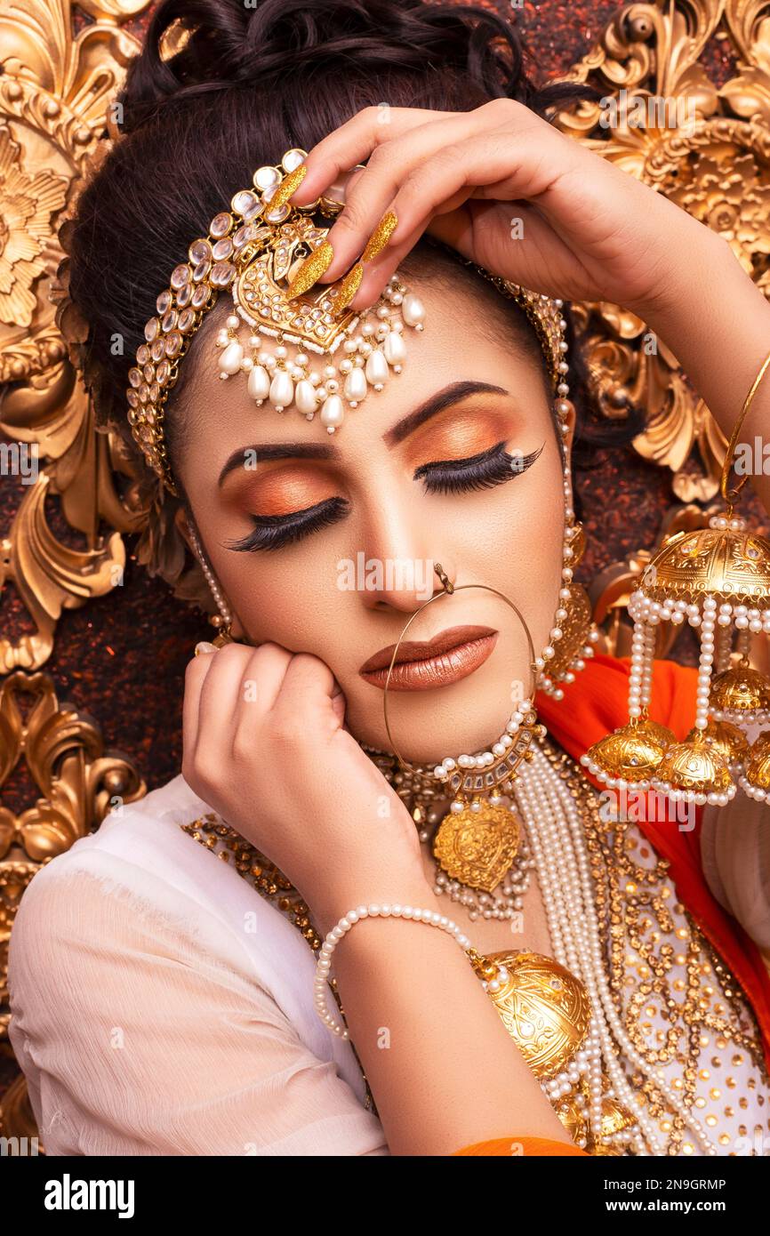 Pakistani. Indian Beautiful bride makeup for saloon shoot Stock Photo ...
