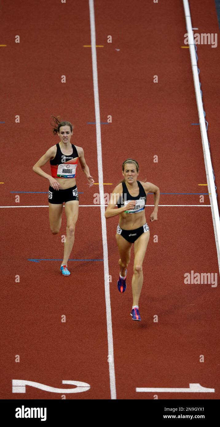 Julie Culley and Molly Huddle race to the finish line during the women ...