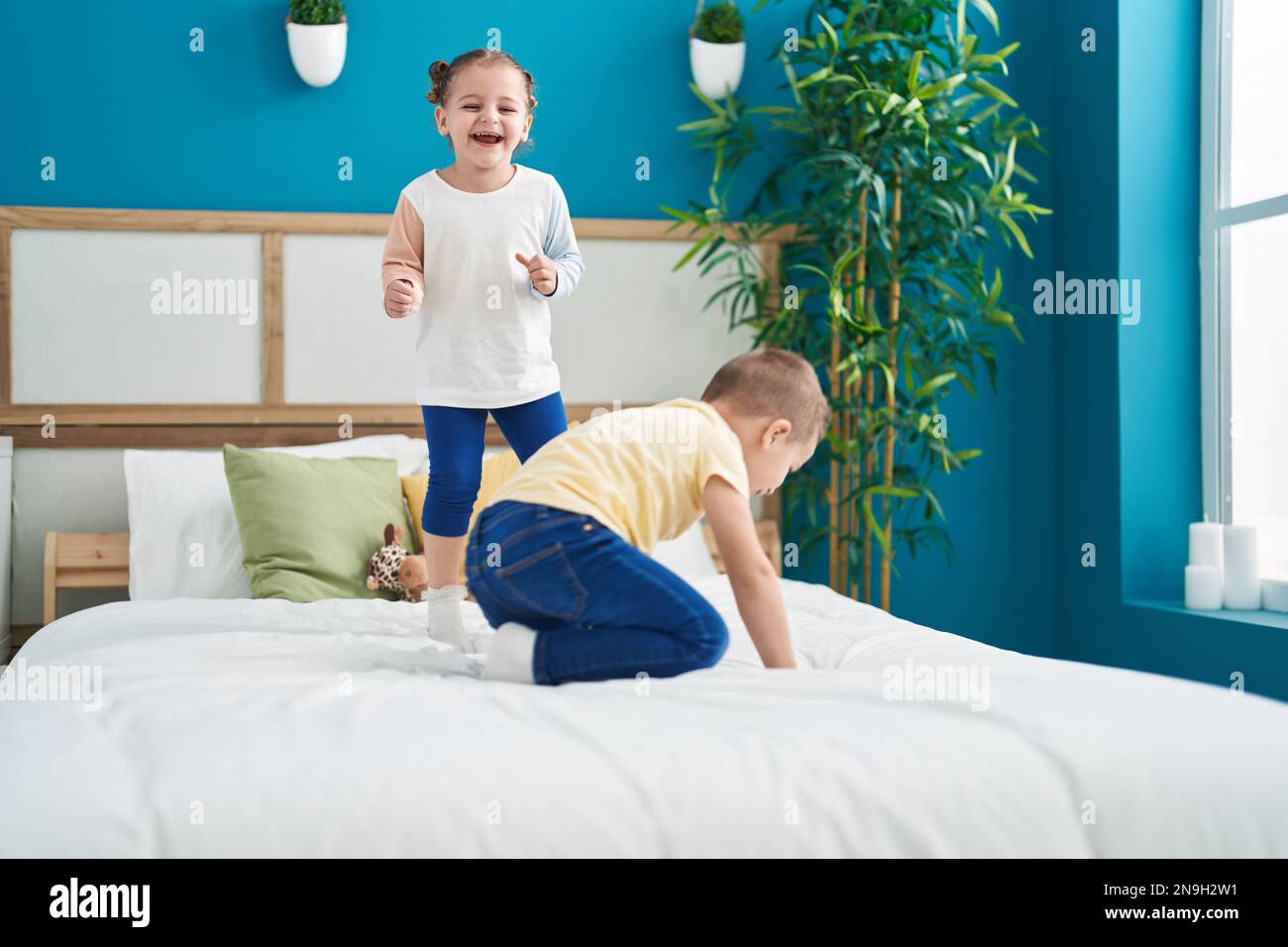 Two children jumping bed hi-res stock photography and images - Alamy